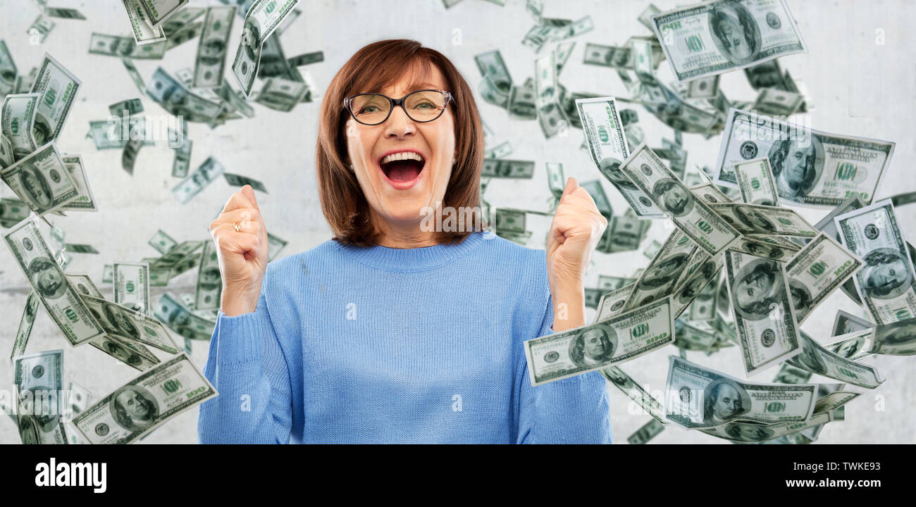 happy senior woman celebrating success over money Stock Photo - Alamy