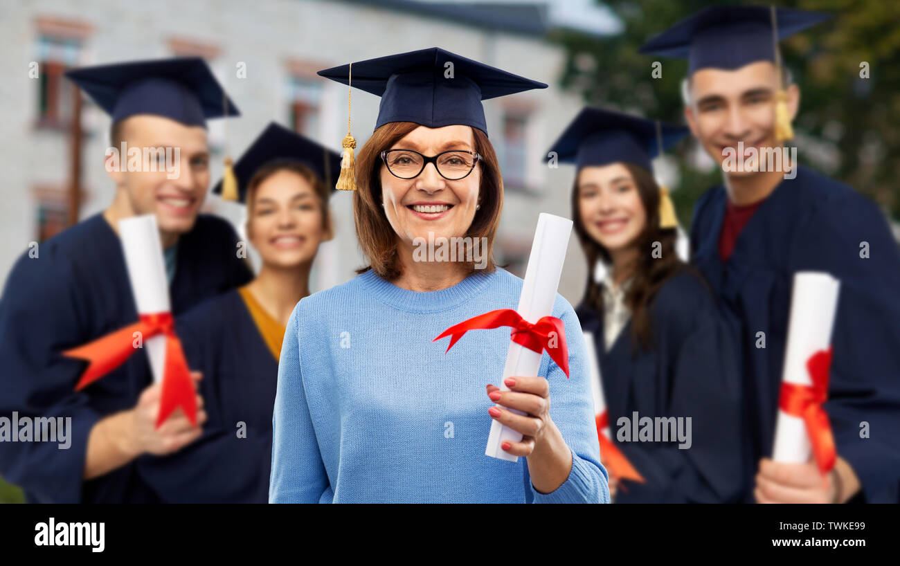 happy senior graduate student woman with diploma Stock Photo - Alamy