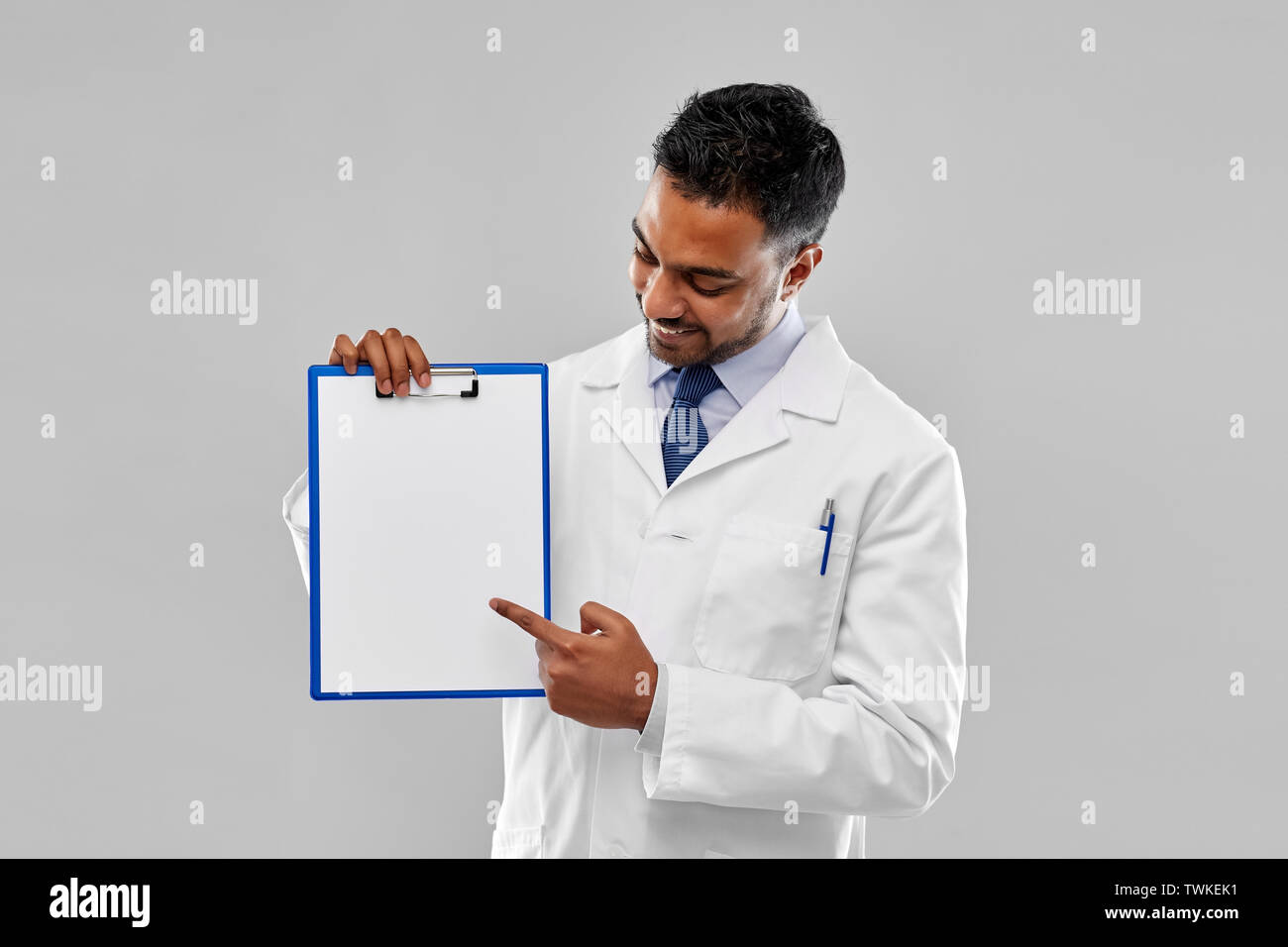 doctor or scientist with white paper on clipboard Stock Photo - Alamy