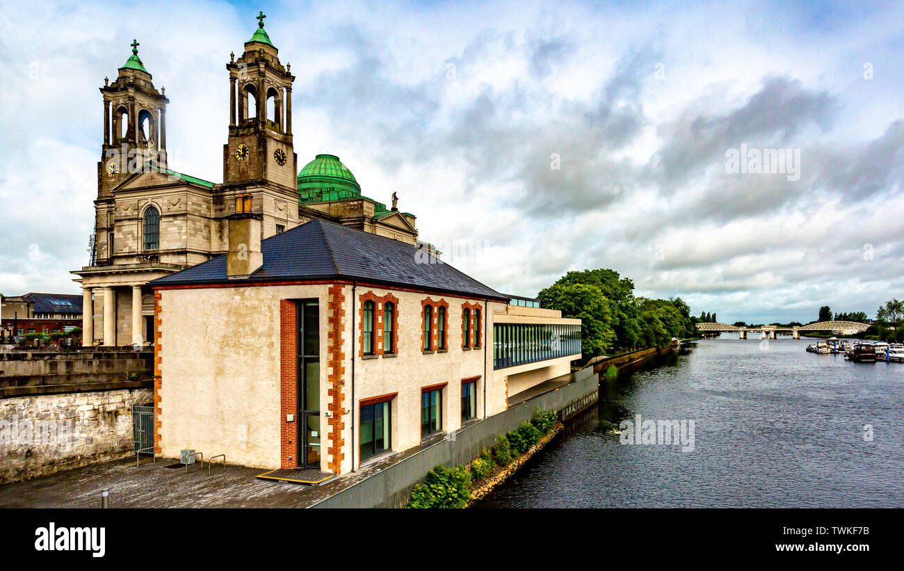 The parish church of Ss. Peter and Paul with their green domes beside ...