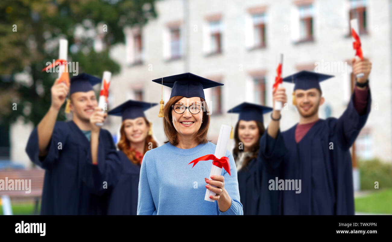 happy senior graduate student woman with diploma Stock Photo - Alamy