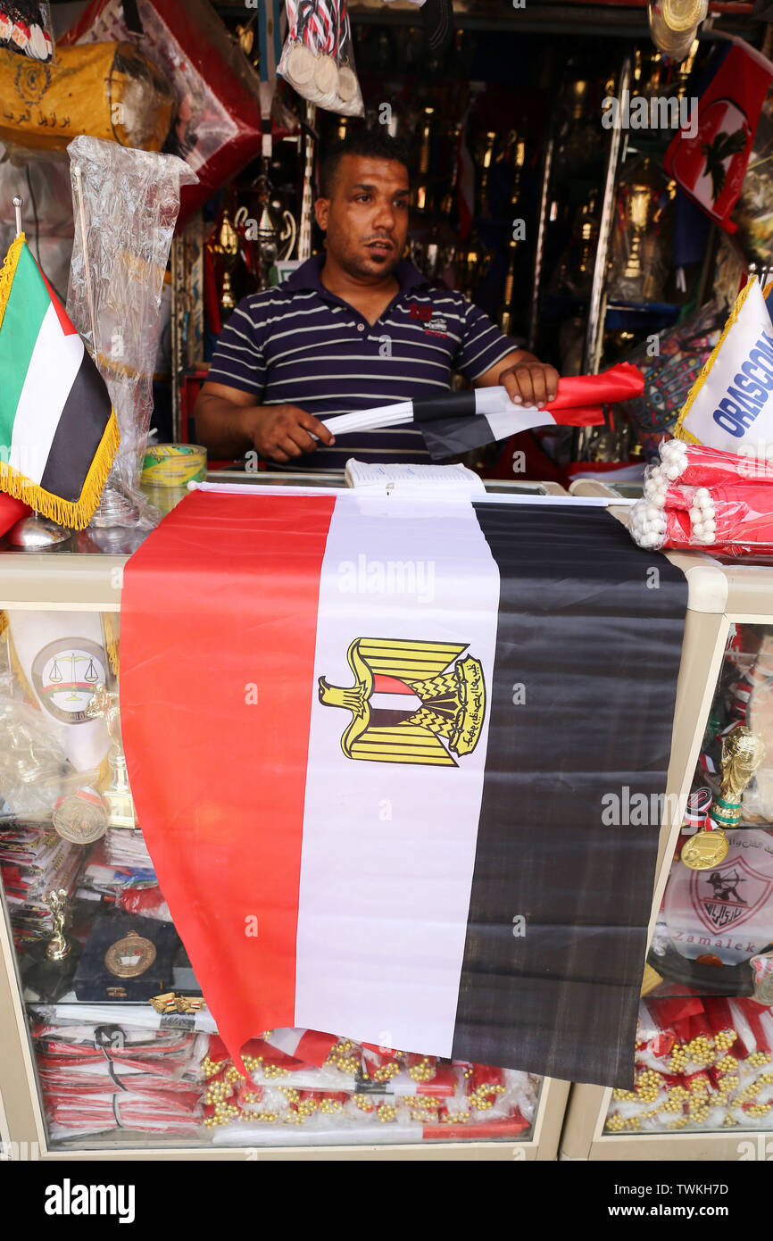 Cairo, Egypt. 20th June, 2019. A retailer sells flags in Attaba ...