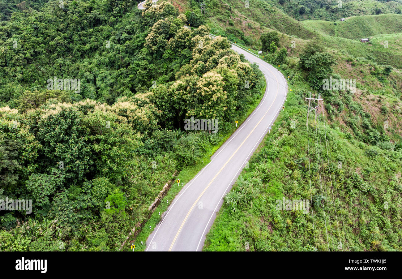 Asphalt curved highway on tropical mountain Stock Photo - Alamy