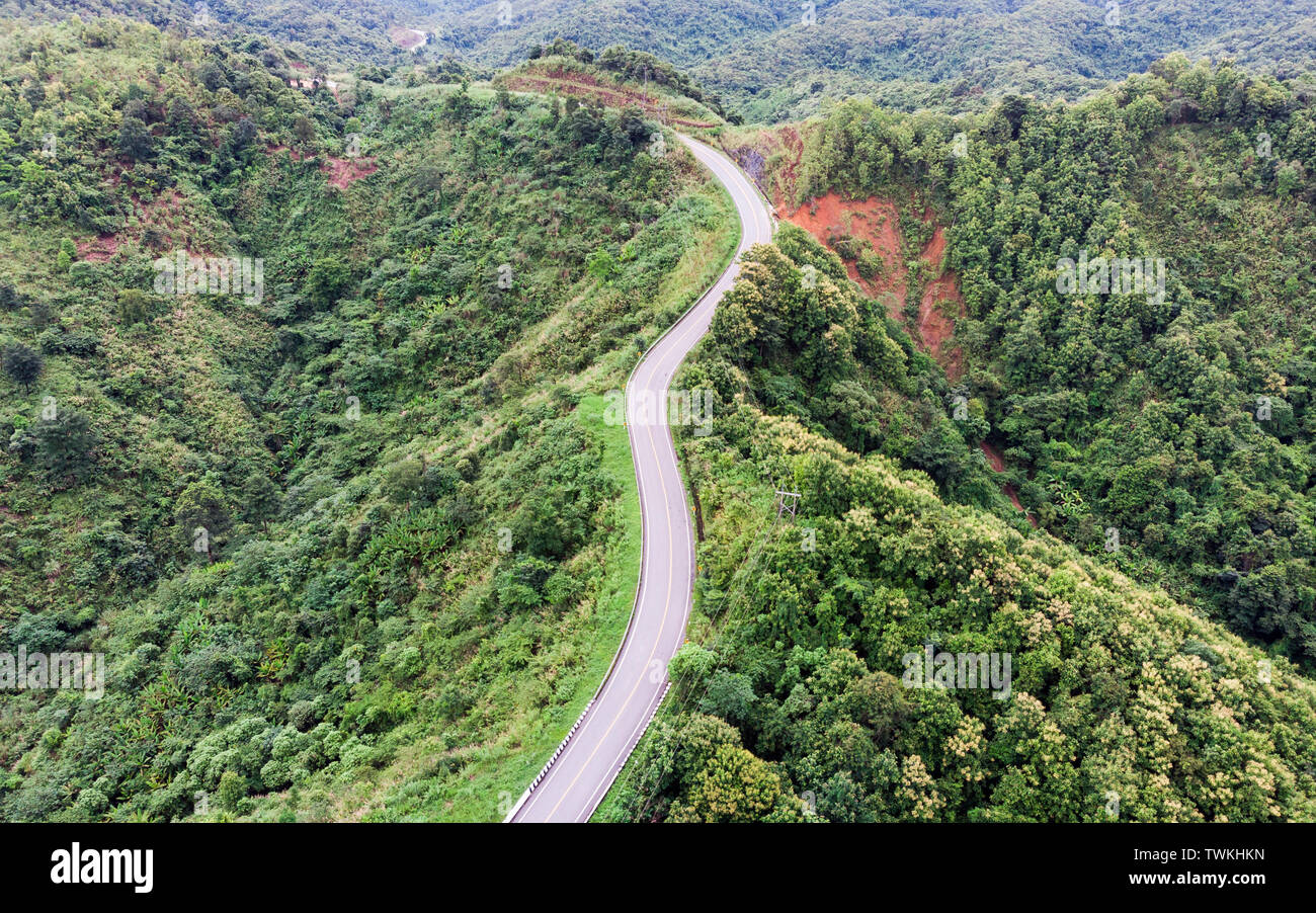 Asphalt curved highway on tropical mountain Stock Photo - Alamy