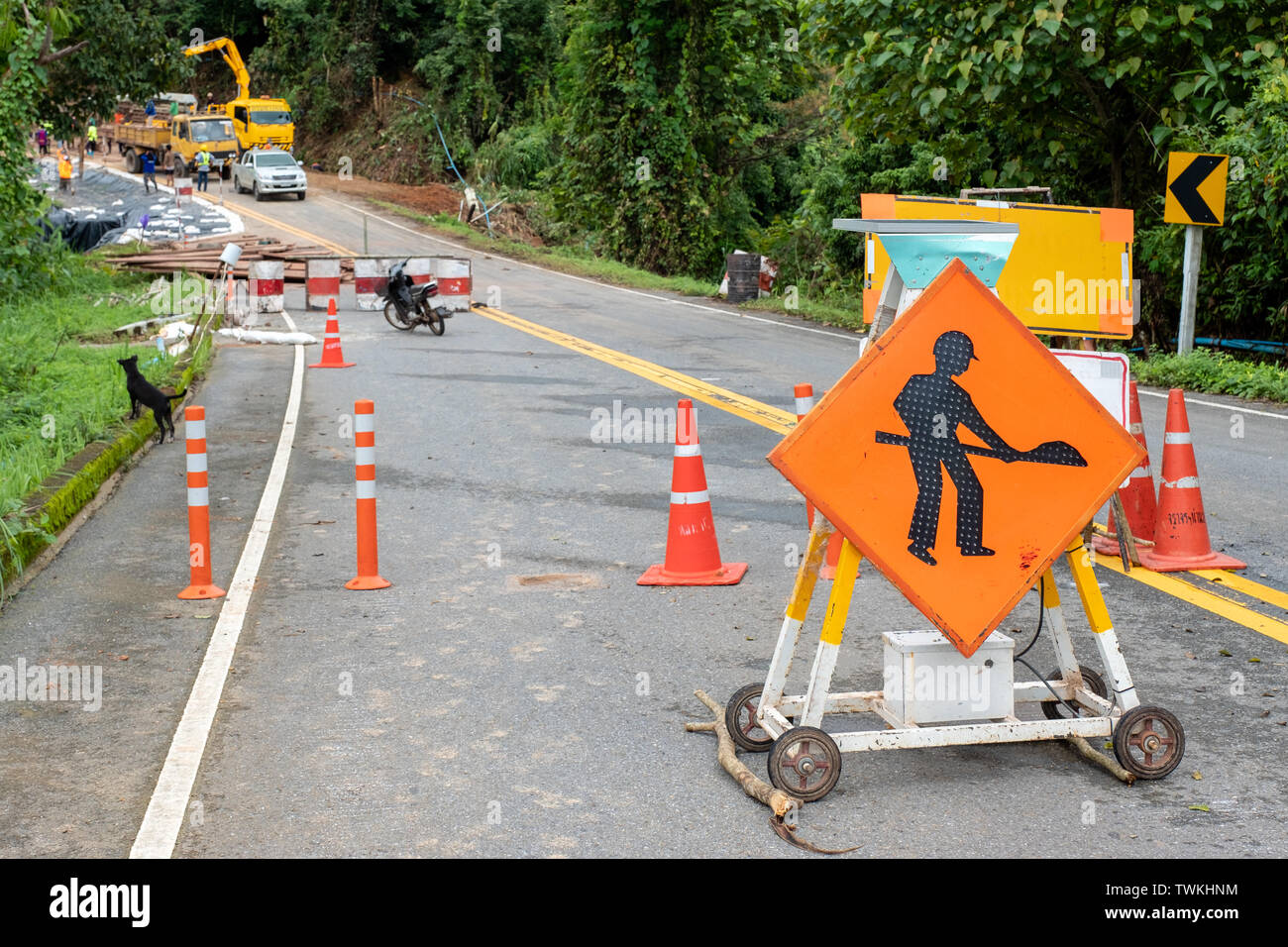 Traffic signs improve repairing on highway with landslide collapsed ...