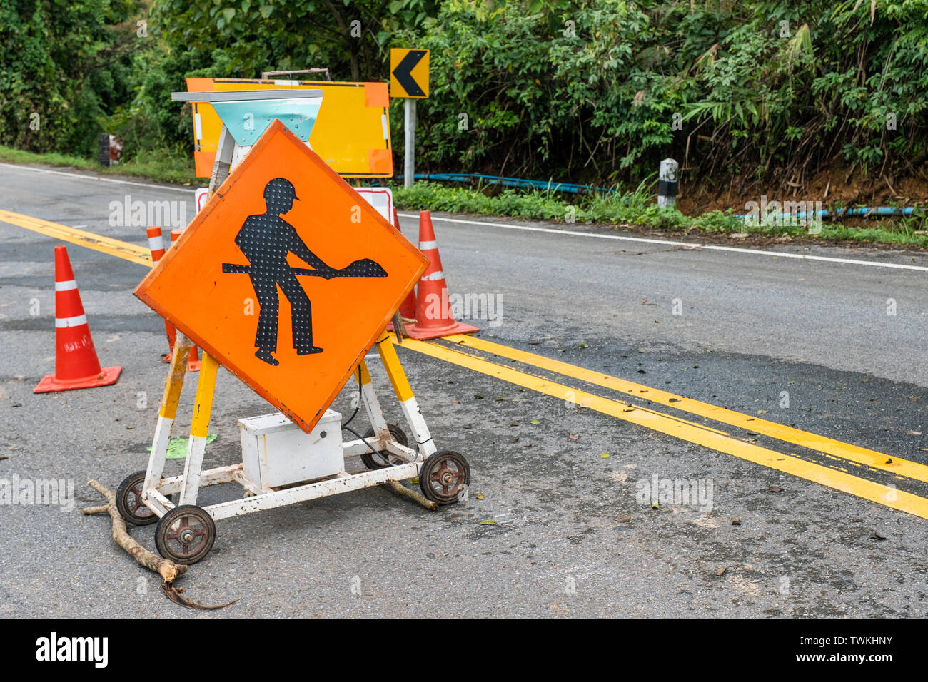 Traffic signs improve repairing on highway with landslide collapsed ...