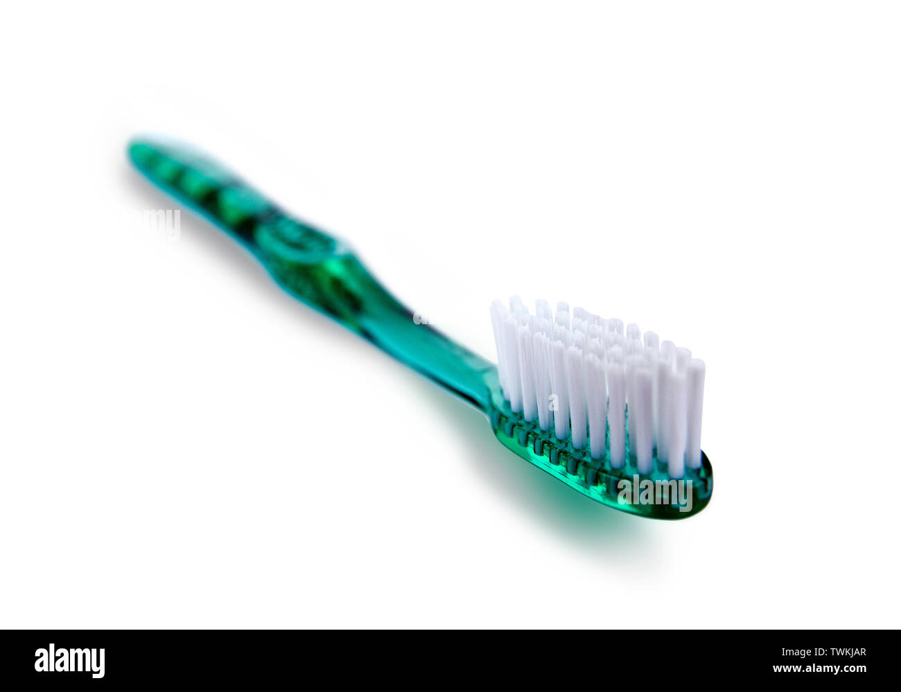 Green toothbrush isolated on white Stock Photo - Alamy