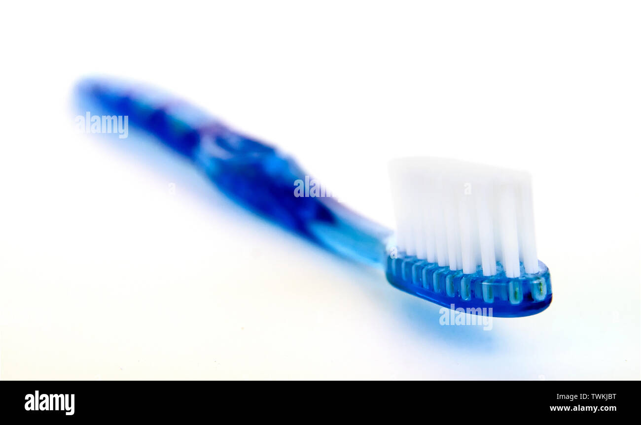 Blue toothbrush isolated on white Stock Photo - Alamy