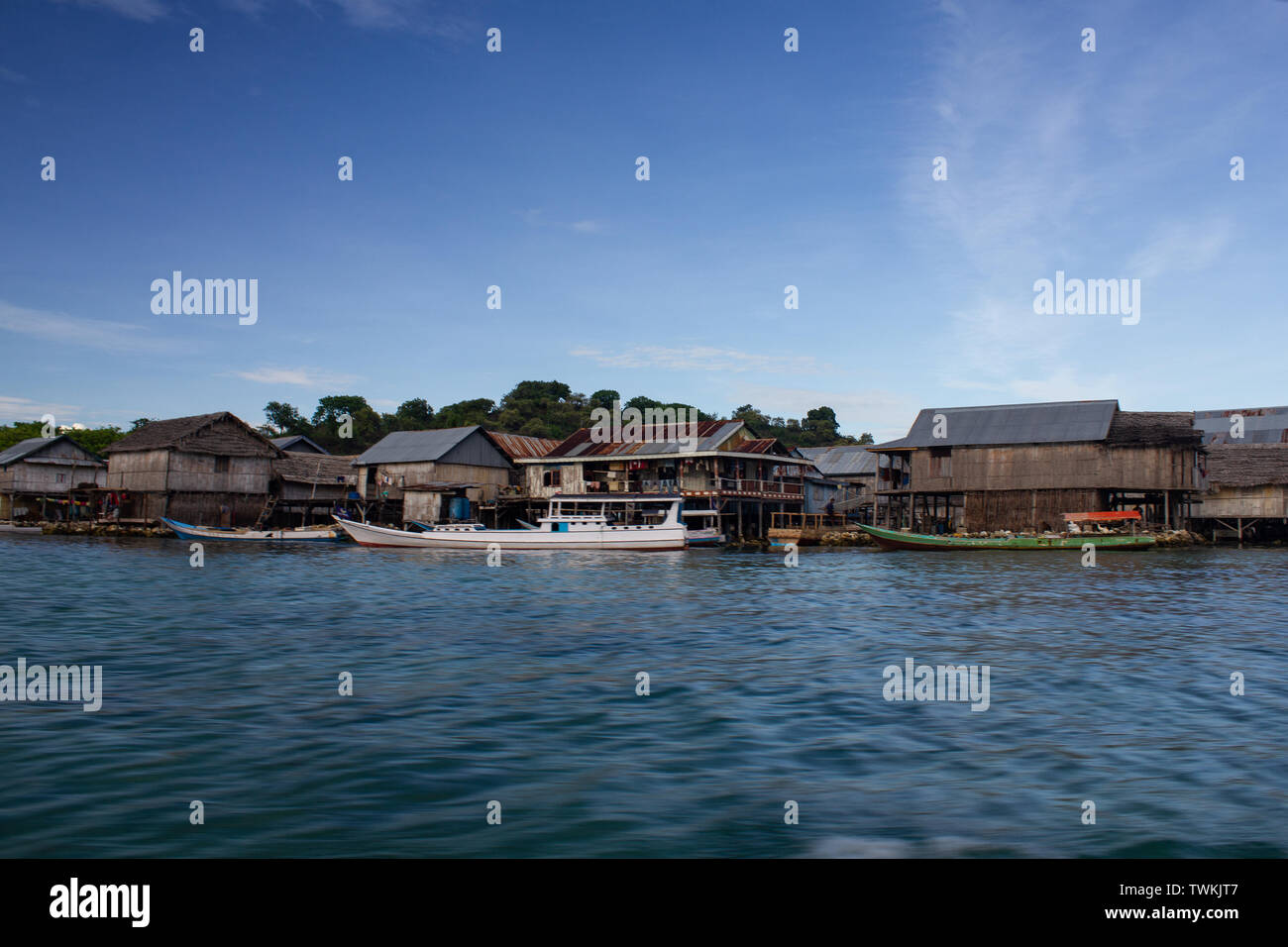 A fishing village built on the sea consists of houses which are made of ...