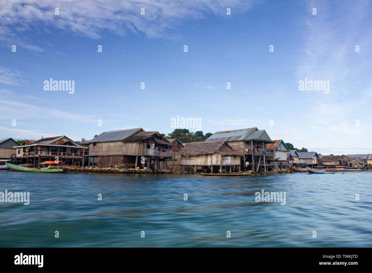 A fishing village built on the sea consists of houses which are made of ...