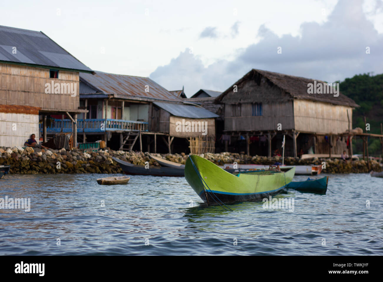 A fishing village built on the sea consists of houses which are made of ...
