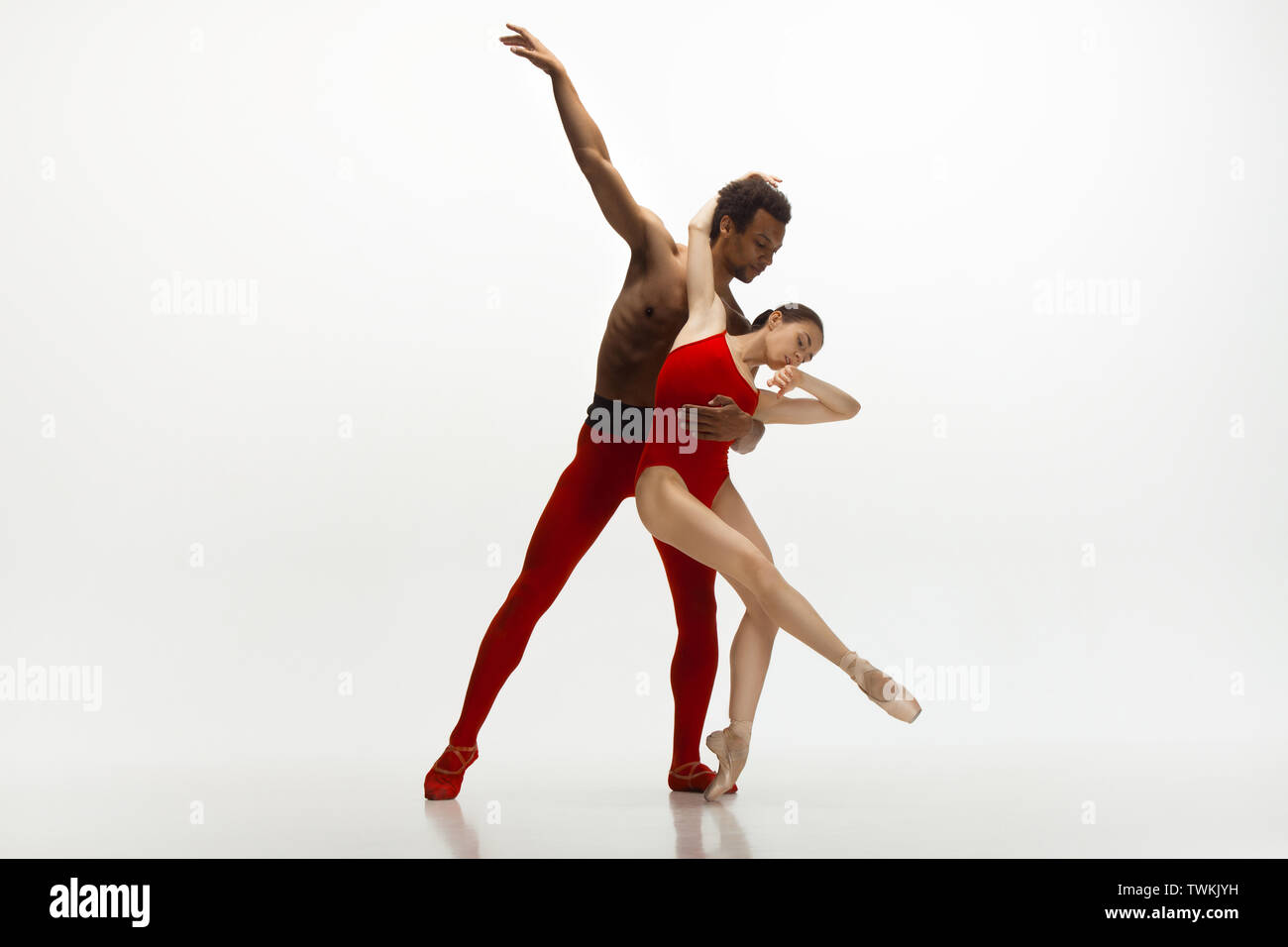 Graceful classic ballet dancers dancing isolated on white studio ...