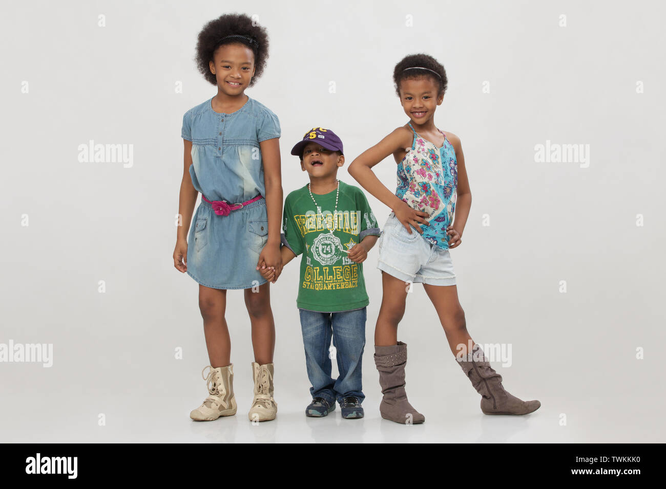 Portrait of three children standing together Stock Photo - Alamy