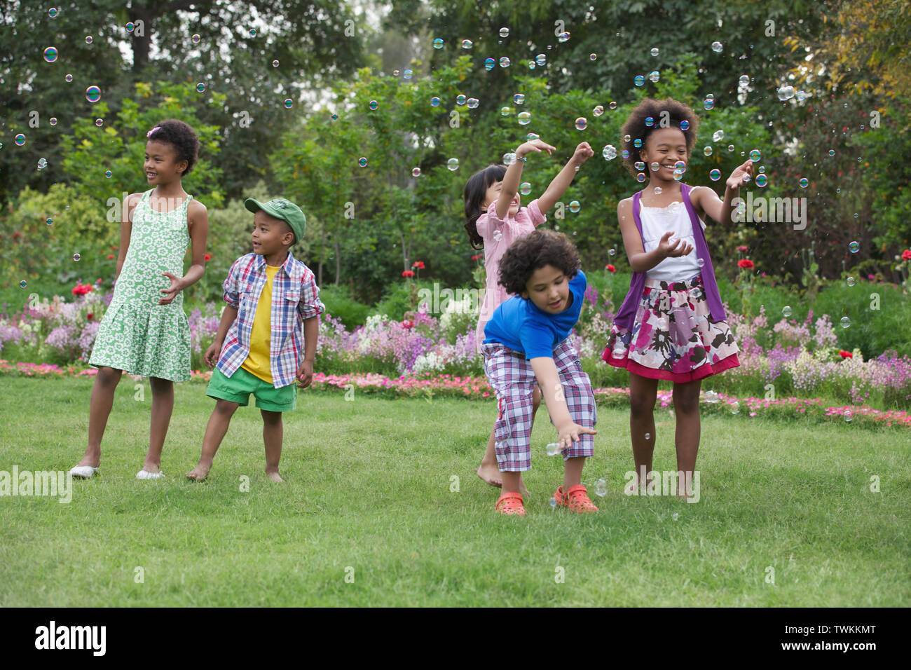 Children playing with floating bubbles Stock Photo - Alamy