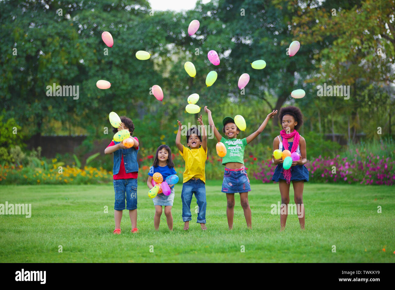 Children playing with balloons Stock Photo - Alamy