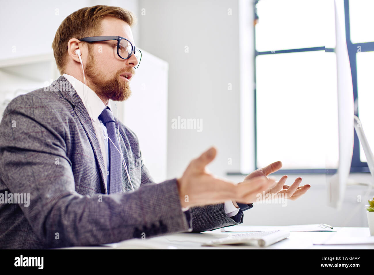 Businessman typing on computer talking hi-res stock photography and ...