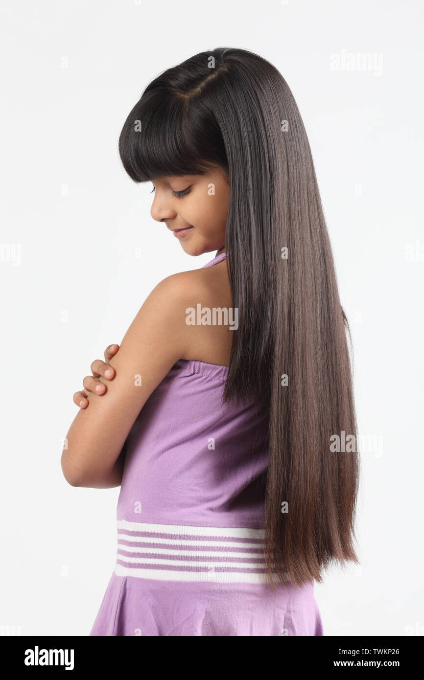 Rear view of a girl showing straight hair Stock Photo - Alamy
