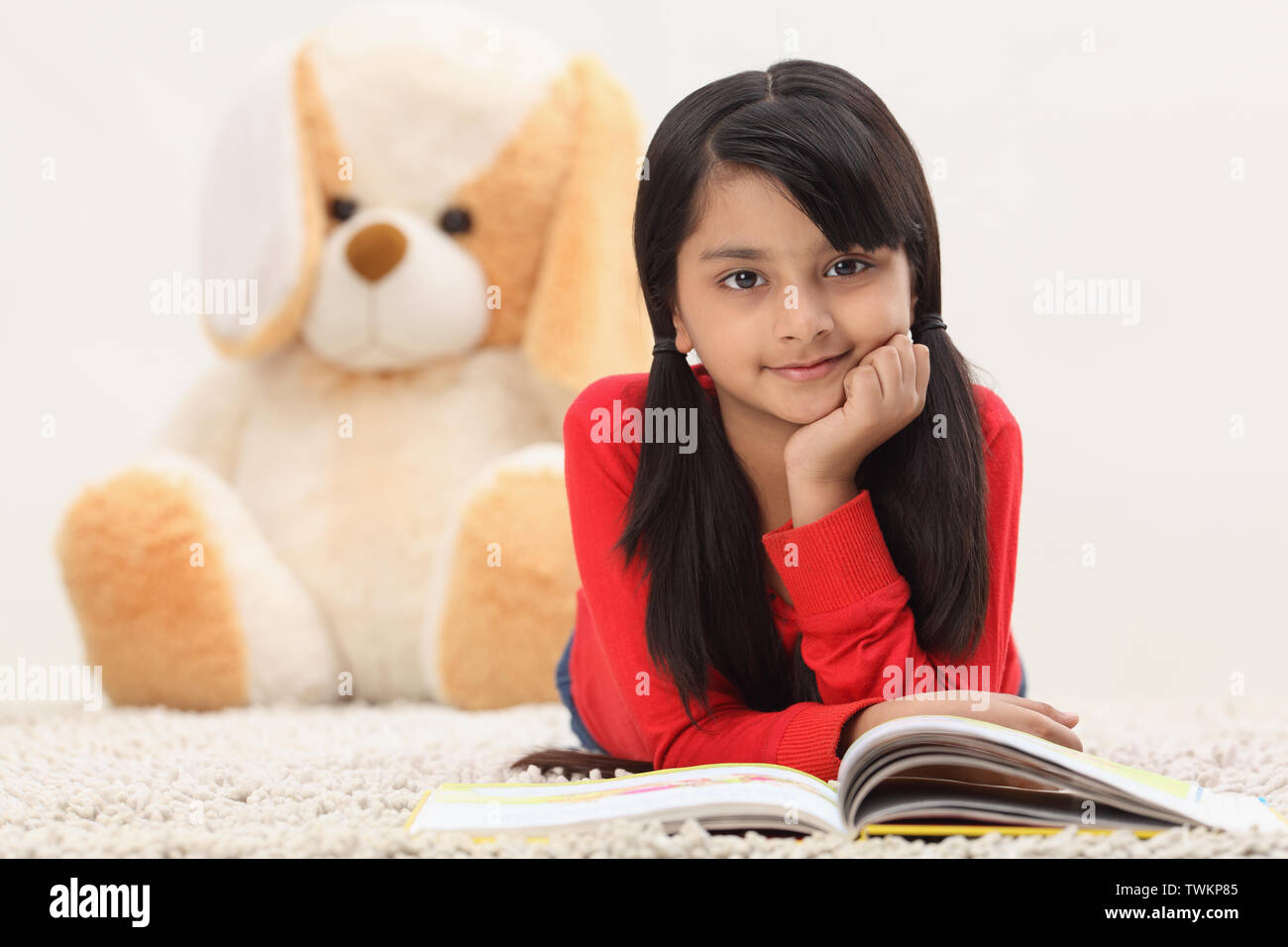 Girl reading a book Stock Photo - Alamy