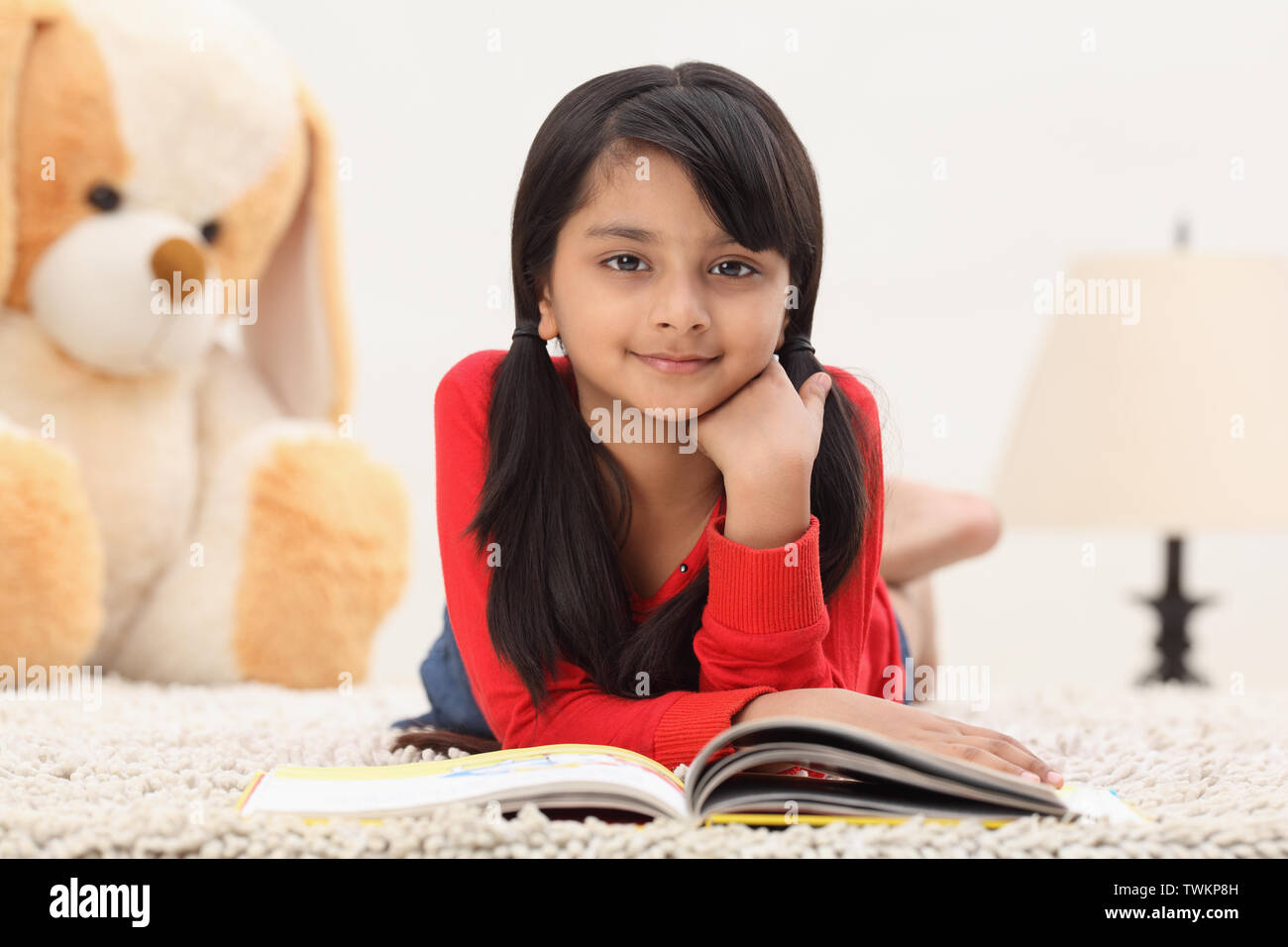 Girl reading a book Stock Photo - Alamy