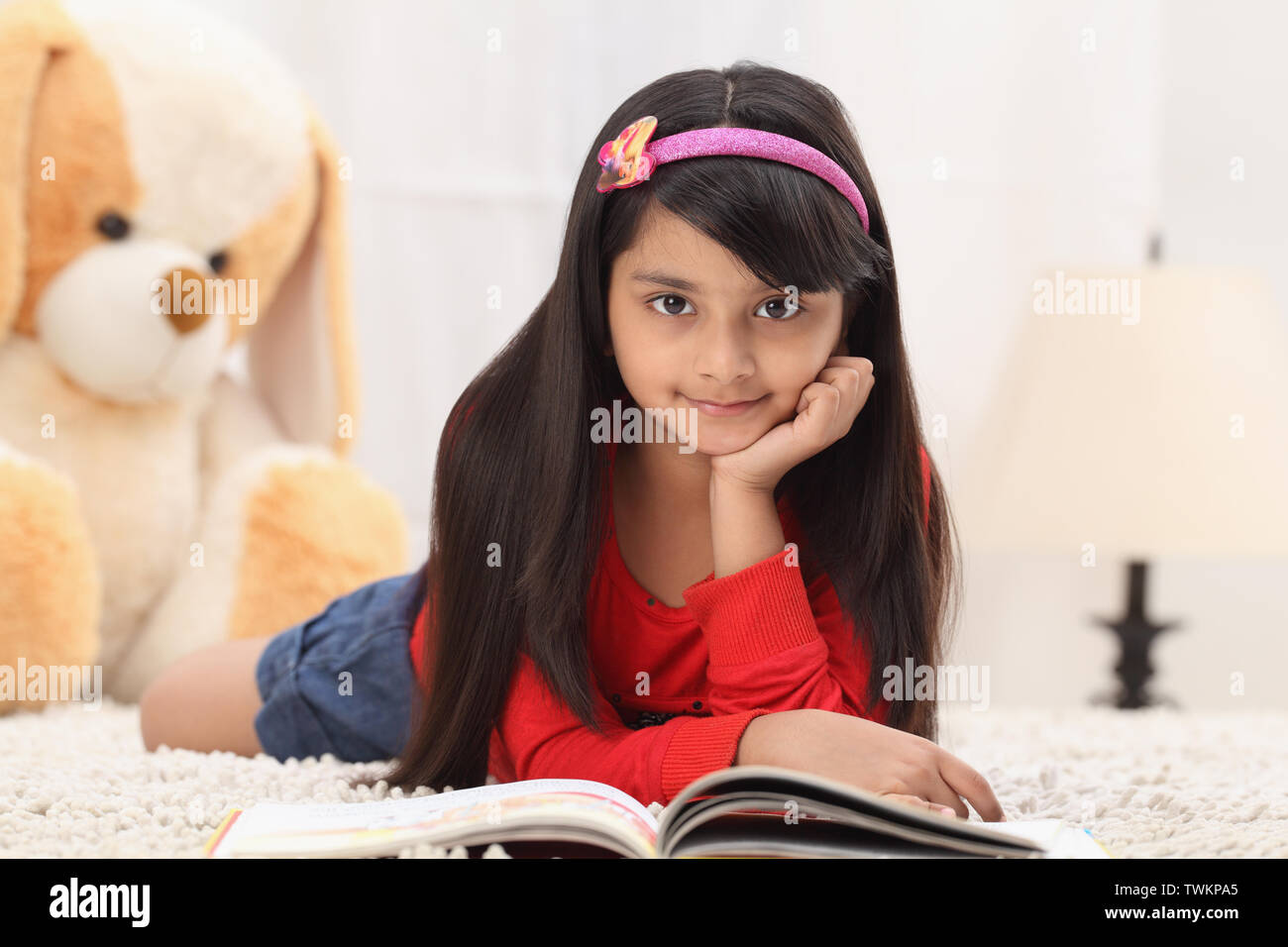 Girl reading a book Stock Photo - Alamy