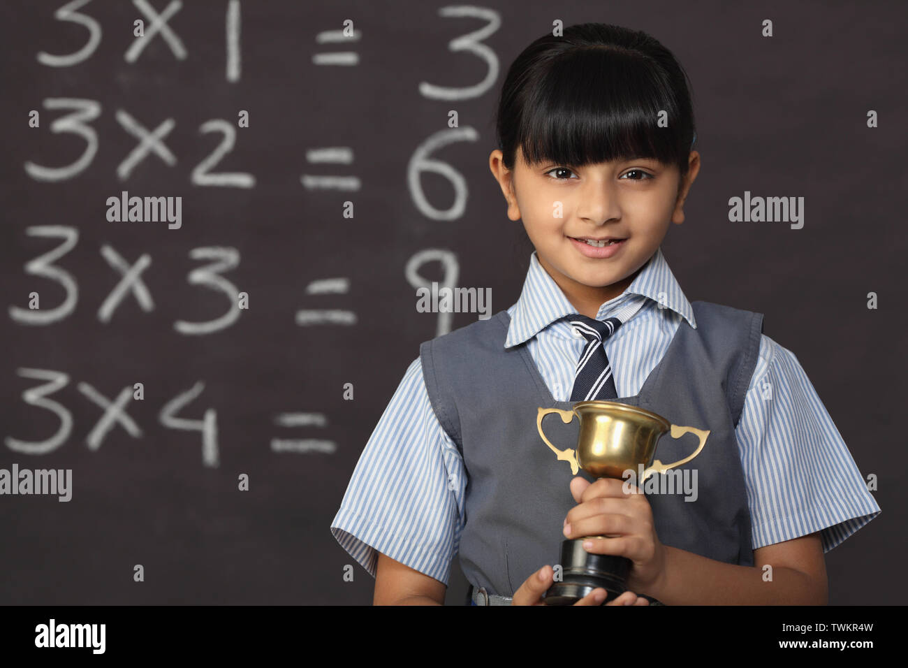 Girl showing winning trophy hi-res stock photography and images - Alamy