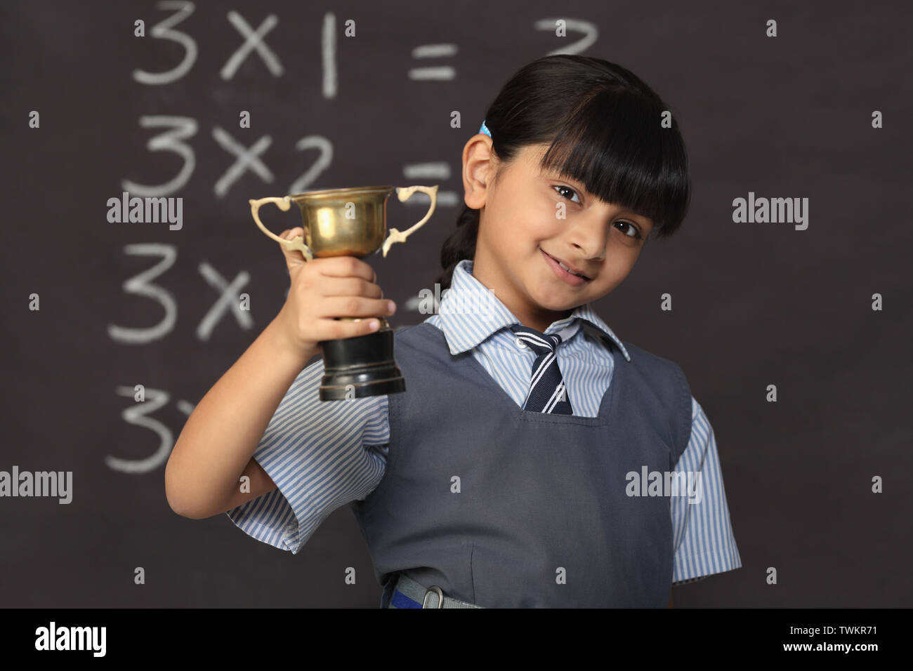 Girl showing winning trophy hi-res stock photography and images - Alamy