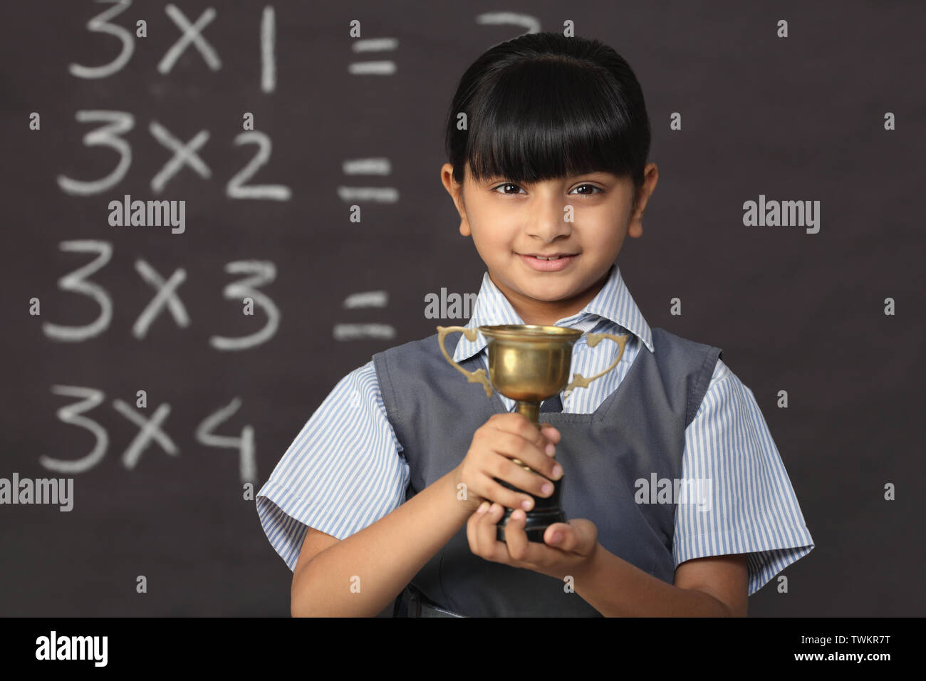 Girl showing winning trophy hi-res stock photography and images - Alamy