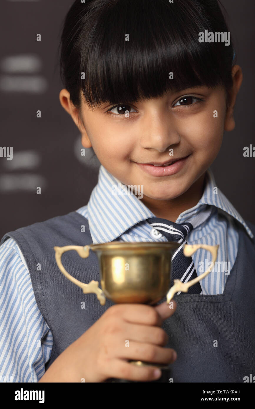 Girl showing winning trophy hi-res stock photography and images - Alamy
