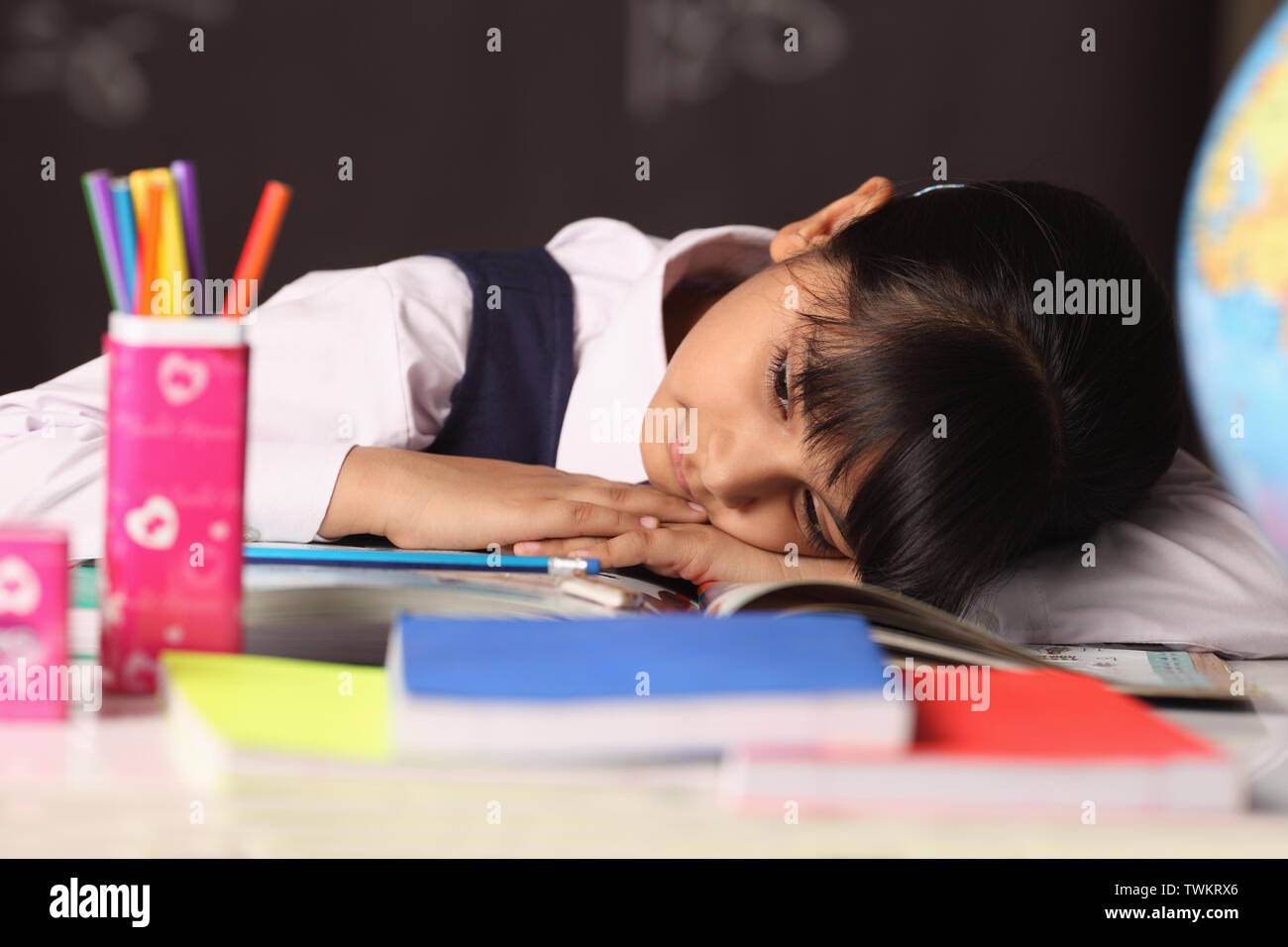 Girl napping on desk hi-res stock photography and images - Alamy