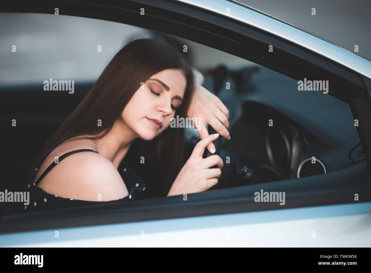 Woman sleeping on wheel hi-res stock photography and images - Alamy