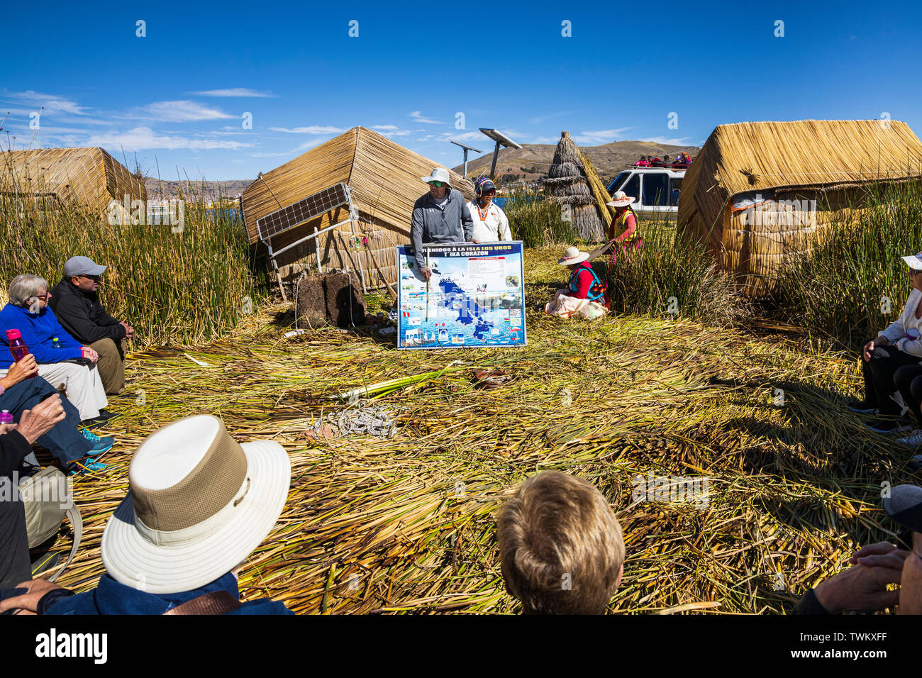 Tour guide explaining the lifestyle of the people living on Uros ...