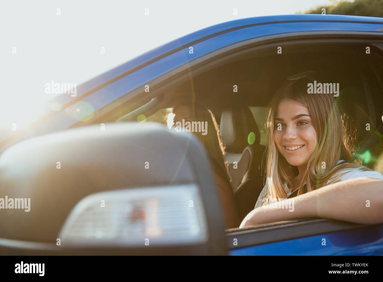 Young girl going for a drive with her mother Stock Photo - Alamy