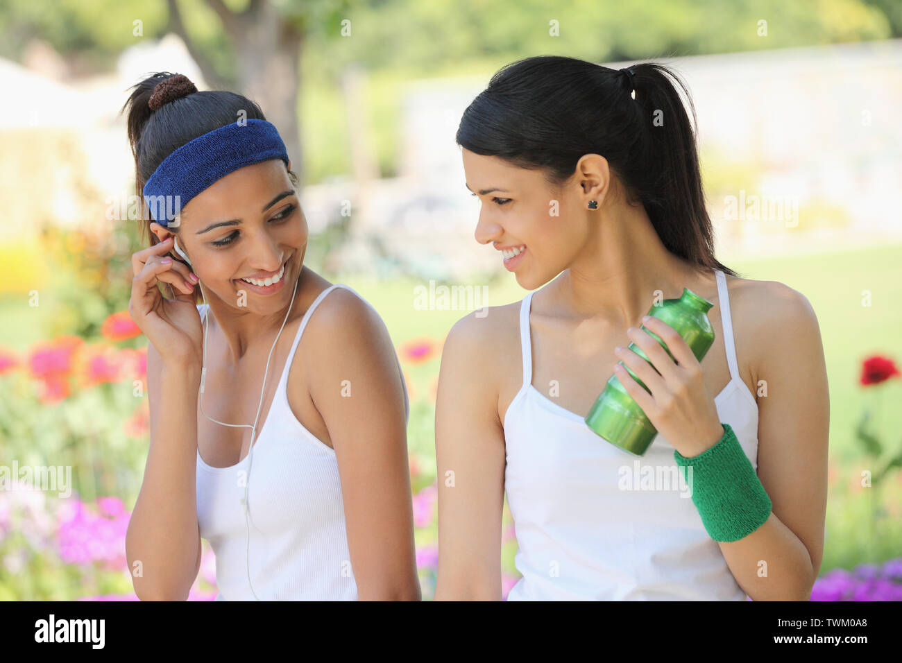 Two women taking a break for exercise Stock Photo - Alamy