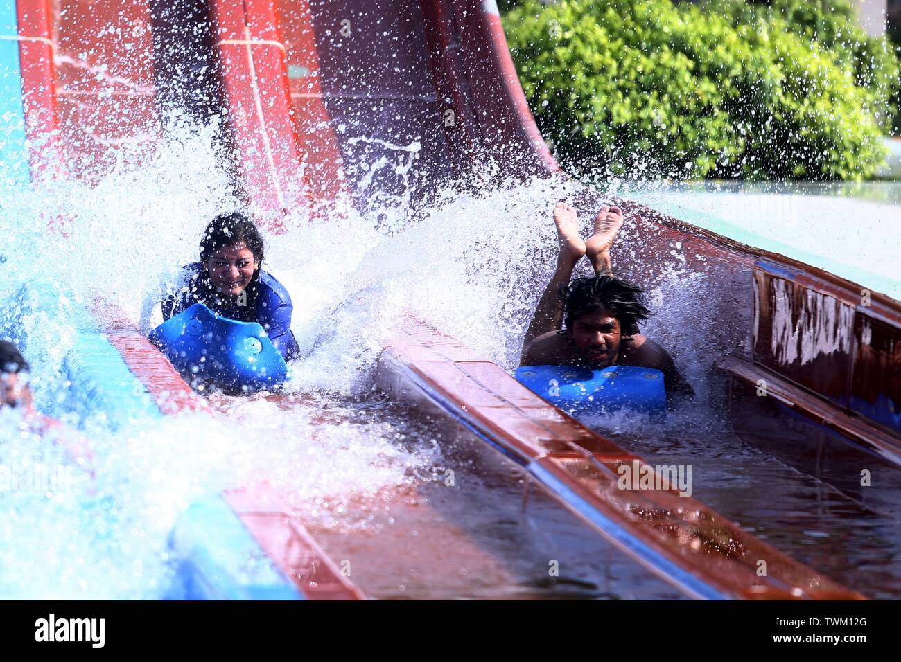 Noida, India. 20th June, 2019. People beat the heat and enjoy various ...