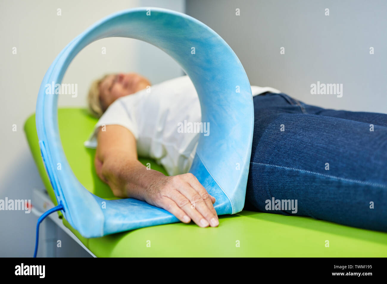 Patient receives magnetic therapy on the wrist as therapy in ...