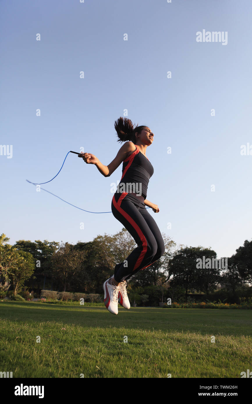 Woman skipping in field hi-res stock photography and images - Alamy