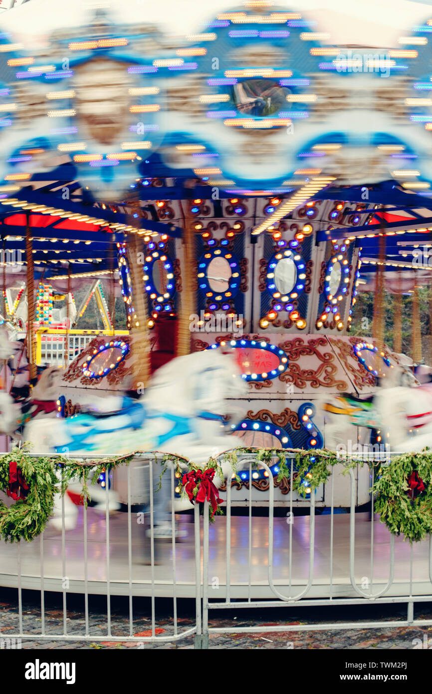 Colorful carousel on traditional holiday Christmas market outdoors ...