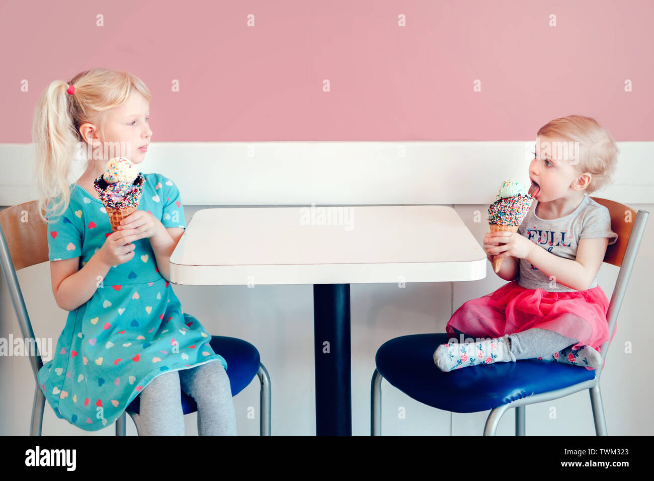 Lifestyle portrait of two happy Caucasian cute adorable funny children ...
