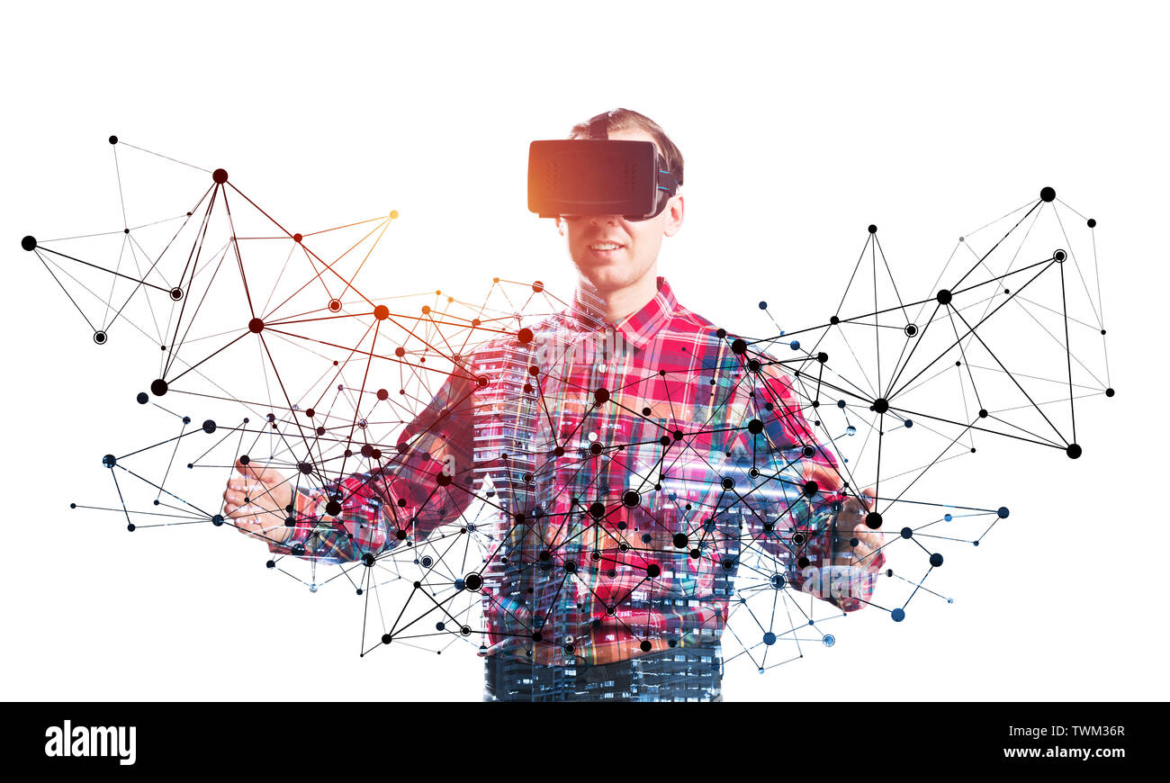 Young programmer wearing VR headset working with virtual model. New ...