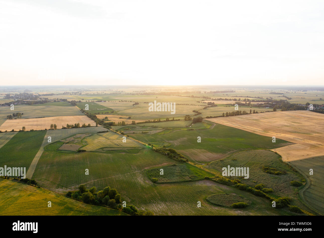 Drone flying over field at sunset hi-res stock photography and images ...