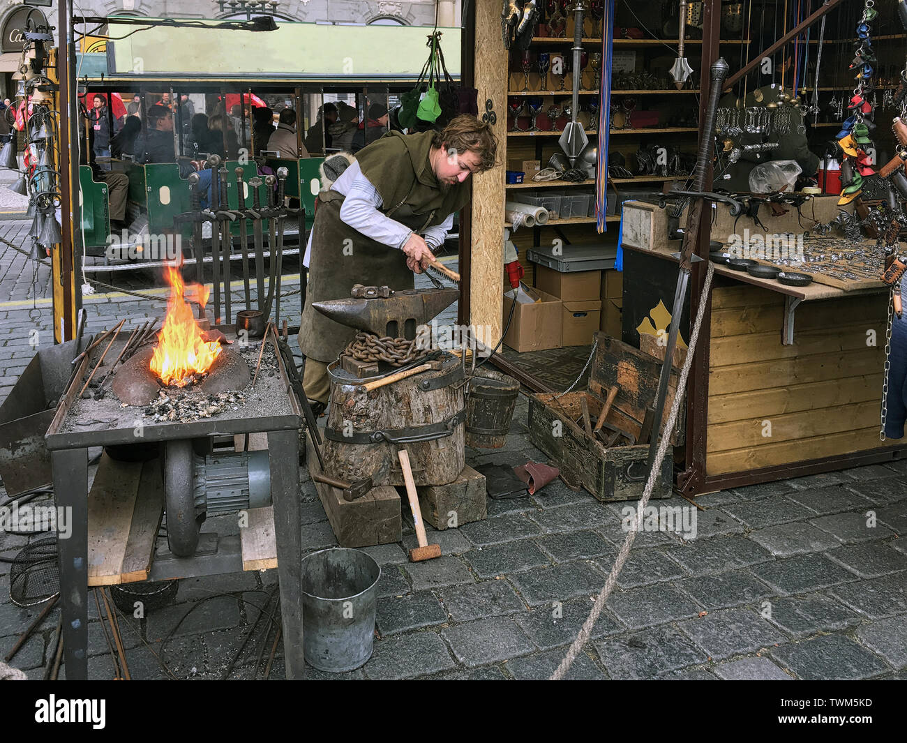 A blacksmith at work forging medieval weapons Stock Photo - Alamy