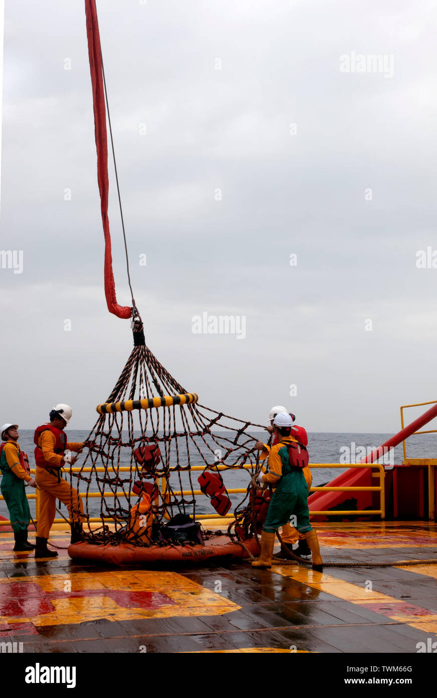 offshore worker using safety basket to boarding oil platform Stock ...