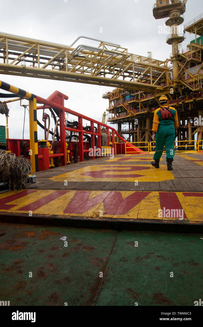 offshore worker working on deck for loading cargo Stock Photo - Alamy