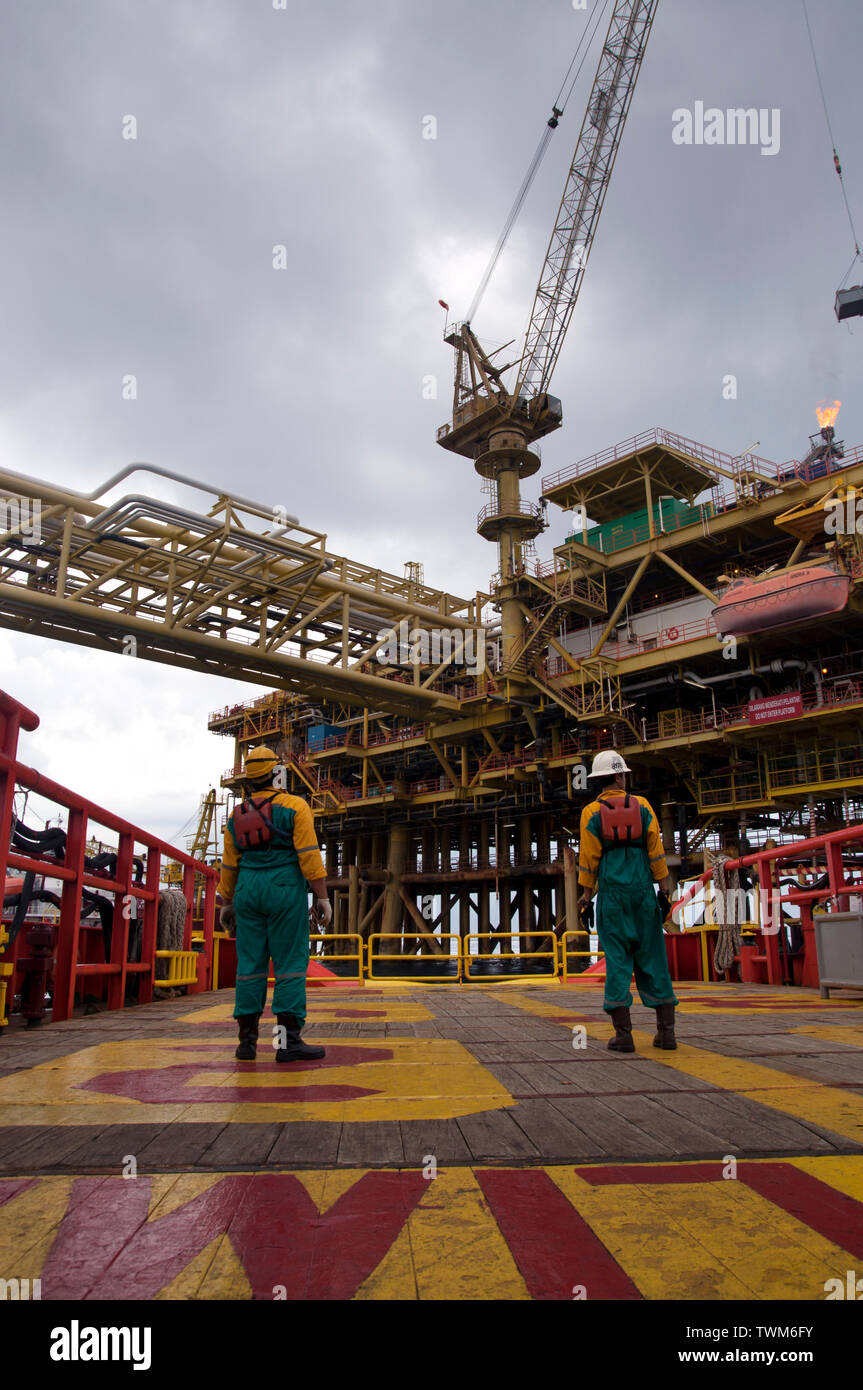 offshore worker working on deck for loading cargo Stock Photo - Alamy