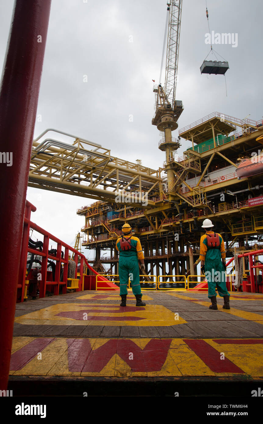 offshore worker working on deck for loading cargo Stock Photo - Alamy