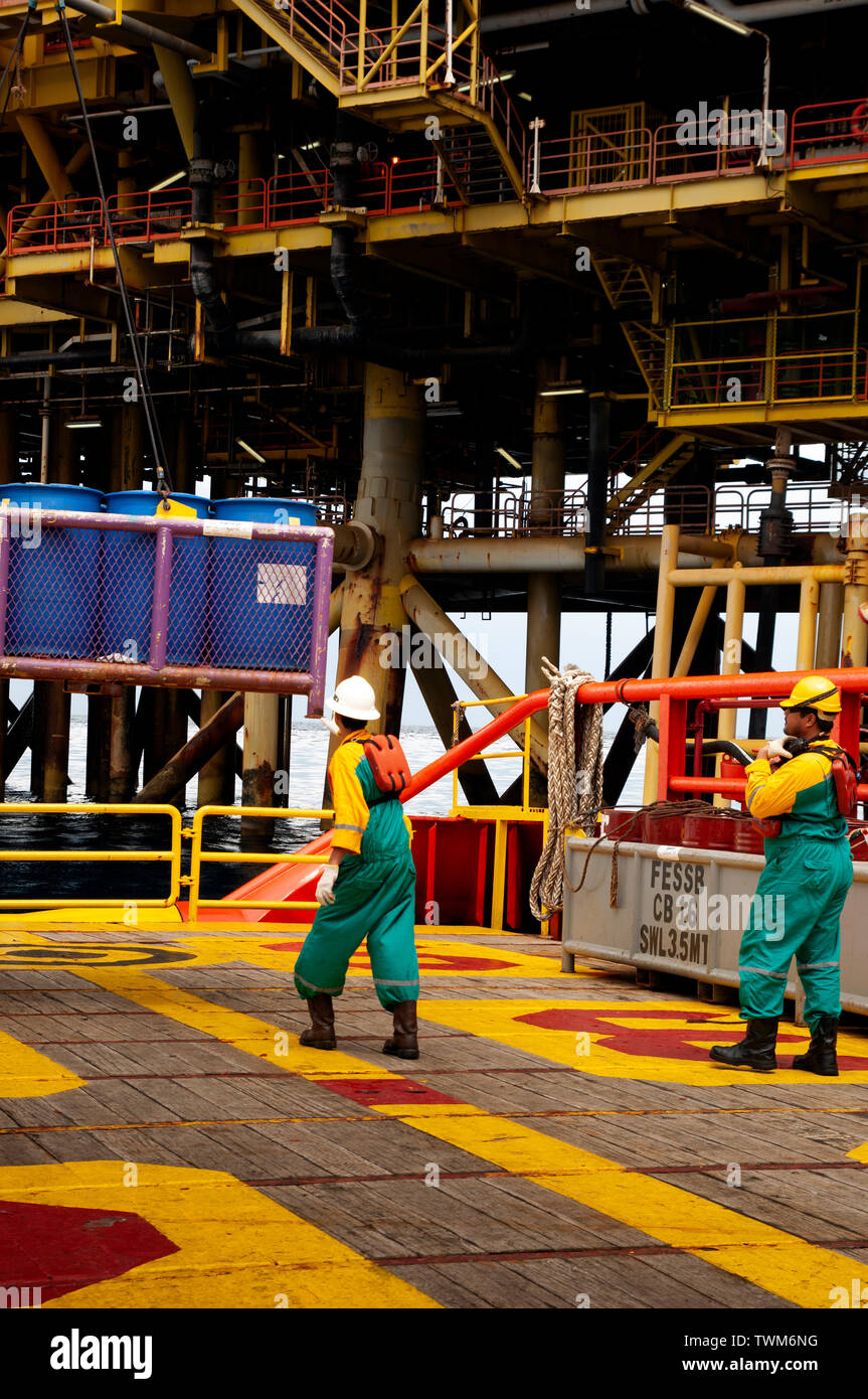 offshore worker working on deck for loading cargo Stock Photo - Alamy