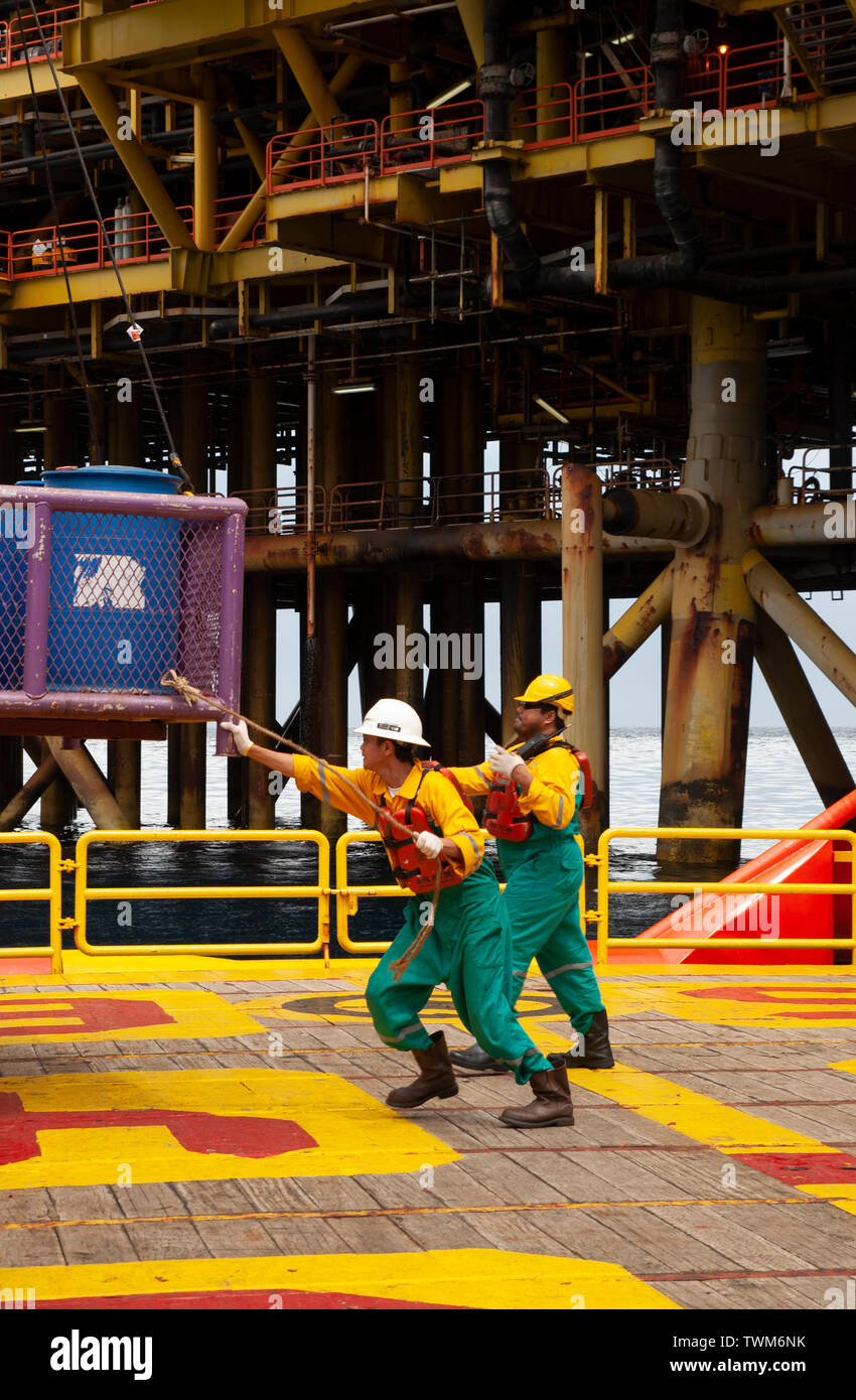 offshore worker working on deck for loading cargo Stock Photo - Alamy