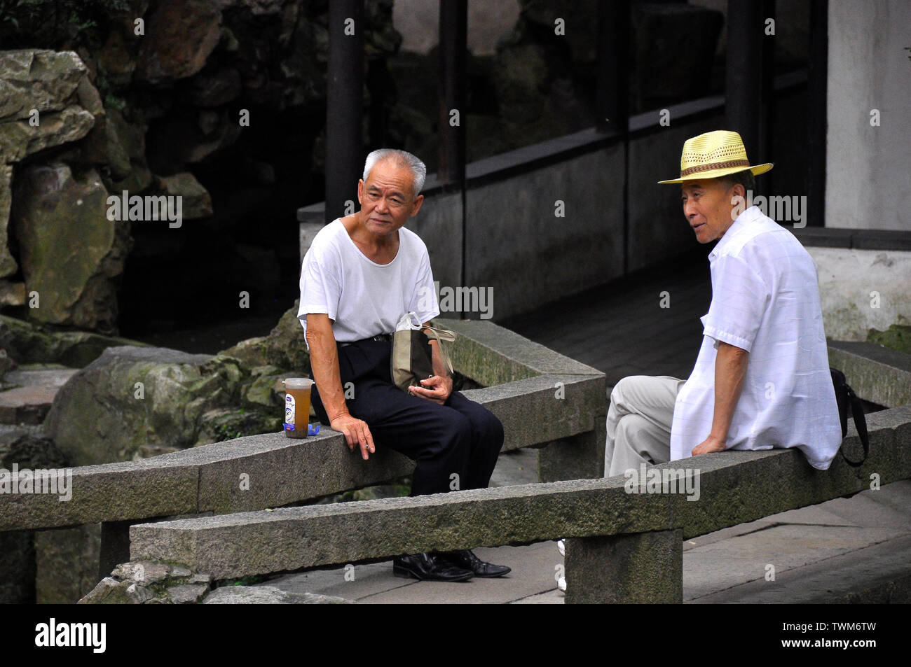 Two elder Chinese men relax in Suzhou China Stock Photo - Alamy