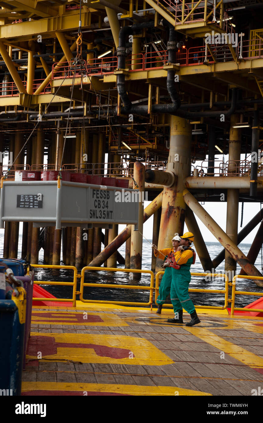 offshore worker working on deck for loading cargo Stock Photo - Alamy