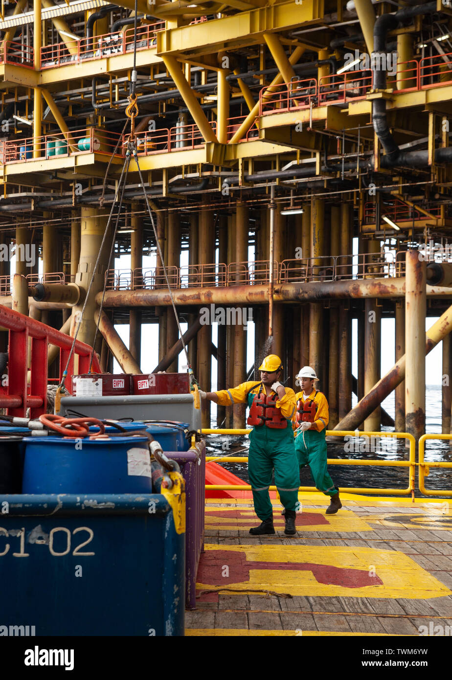 offshore worker working on deck for loading cargo Stock Photo - Alamy